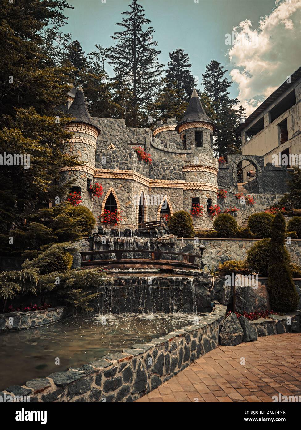 The vertical view of a medieval castle-like designed building with a ...