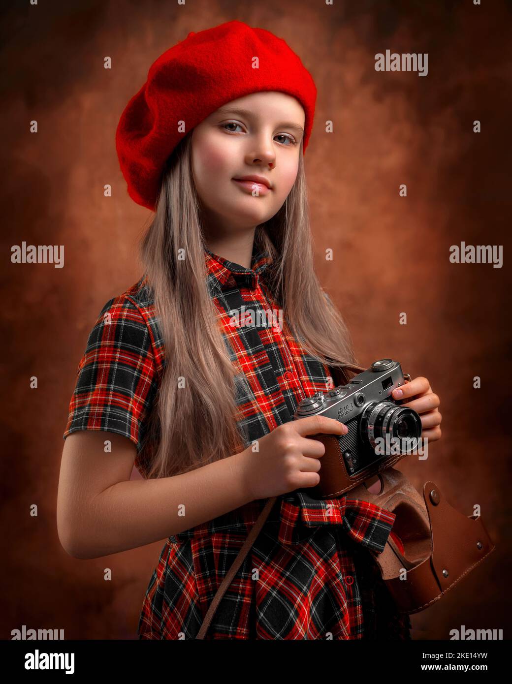 girl with a camera smiling and going to take pictures Stock Photo - Alamy