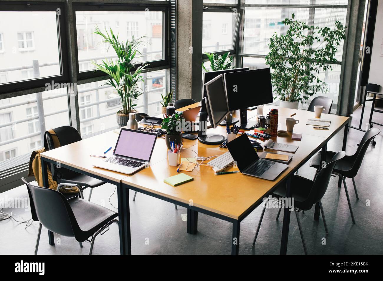 Laptop and computer on desk at office Stock Photo - Alamy