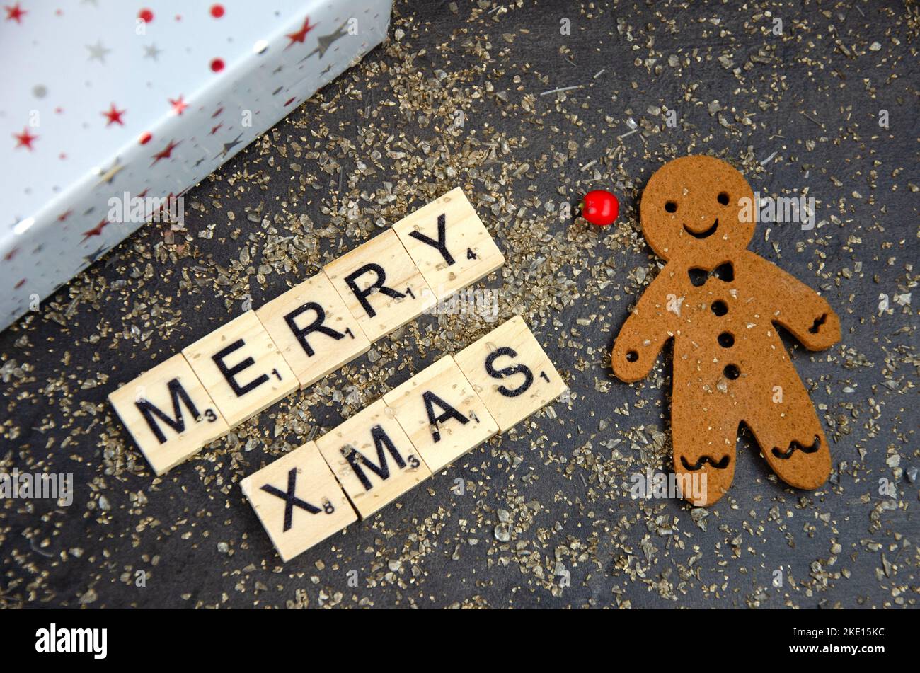 Happy christmas message with present and gingerbread man Stock Photo ...
