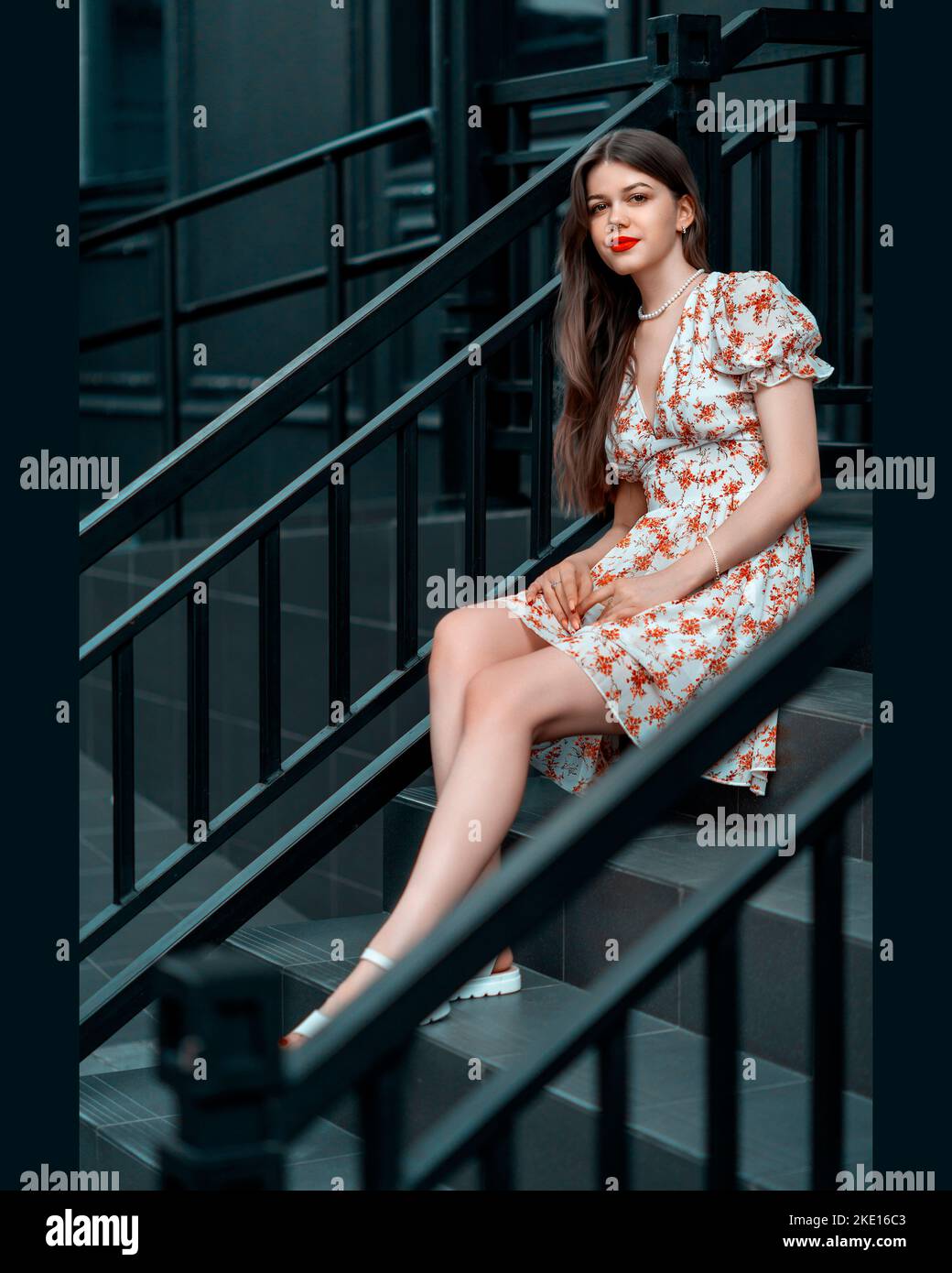 Brunette girl in red dress] hi-res stock photography and images - Alamy