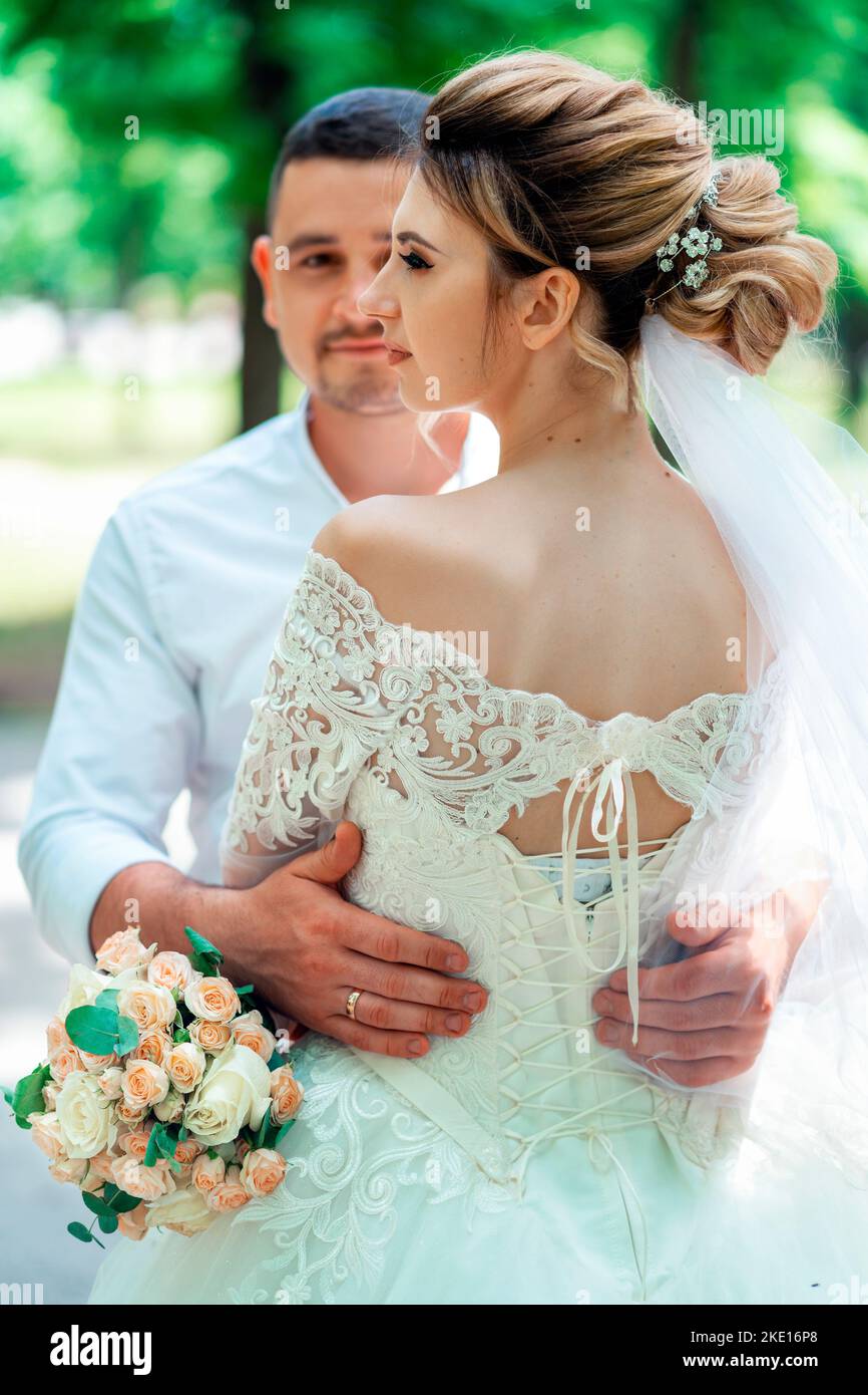 The groom looks at the silhouette of his bride Stock Photo - Alamy
