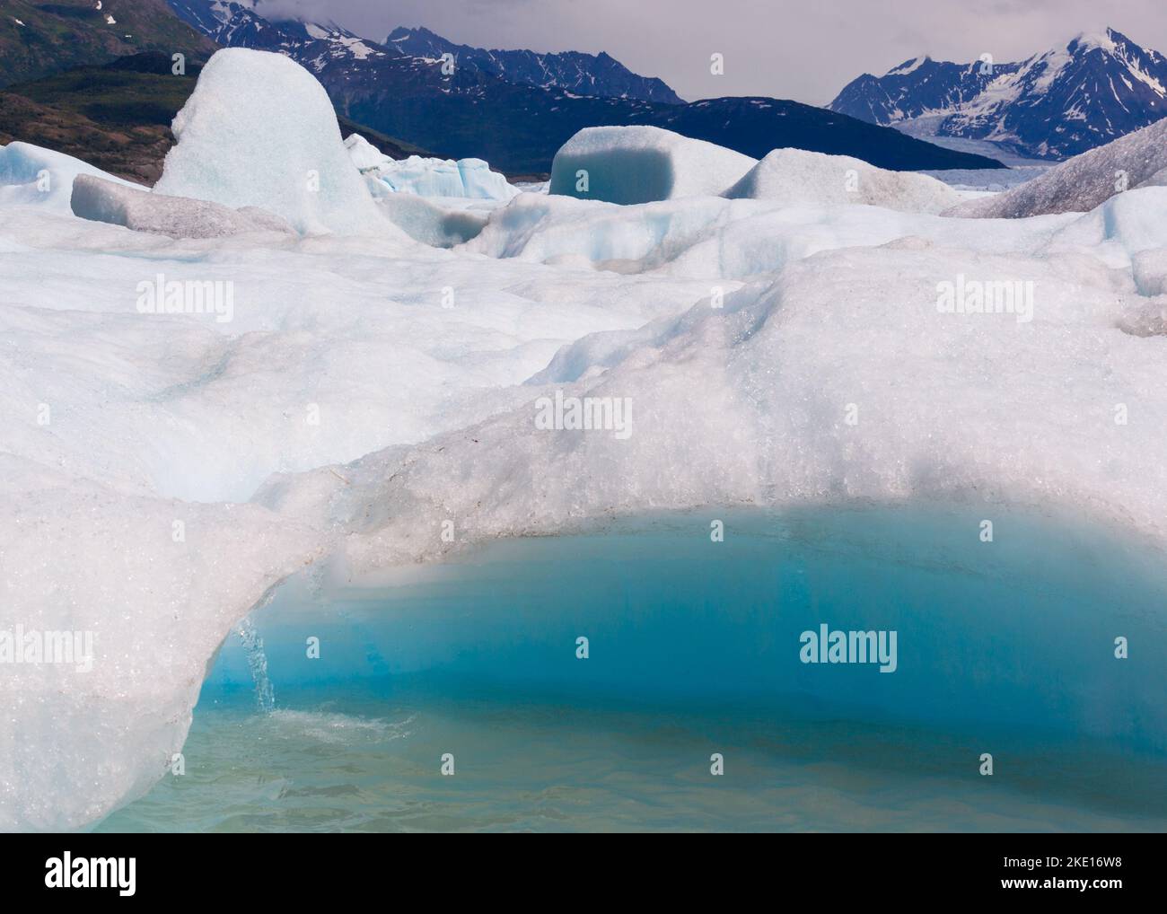 The view of a mountainside iced lake melting under the sunlight Stock ...