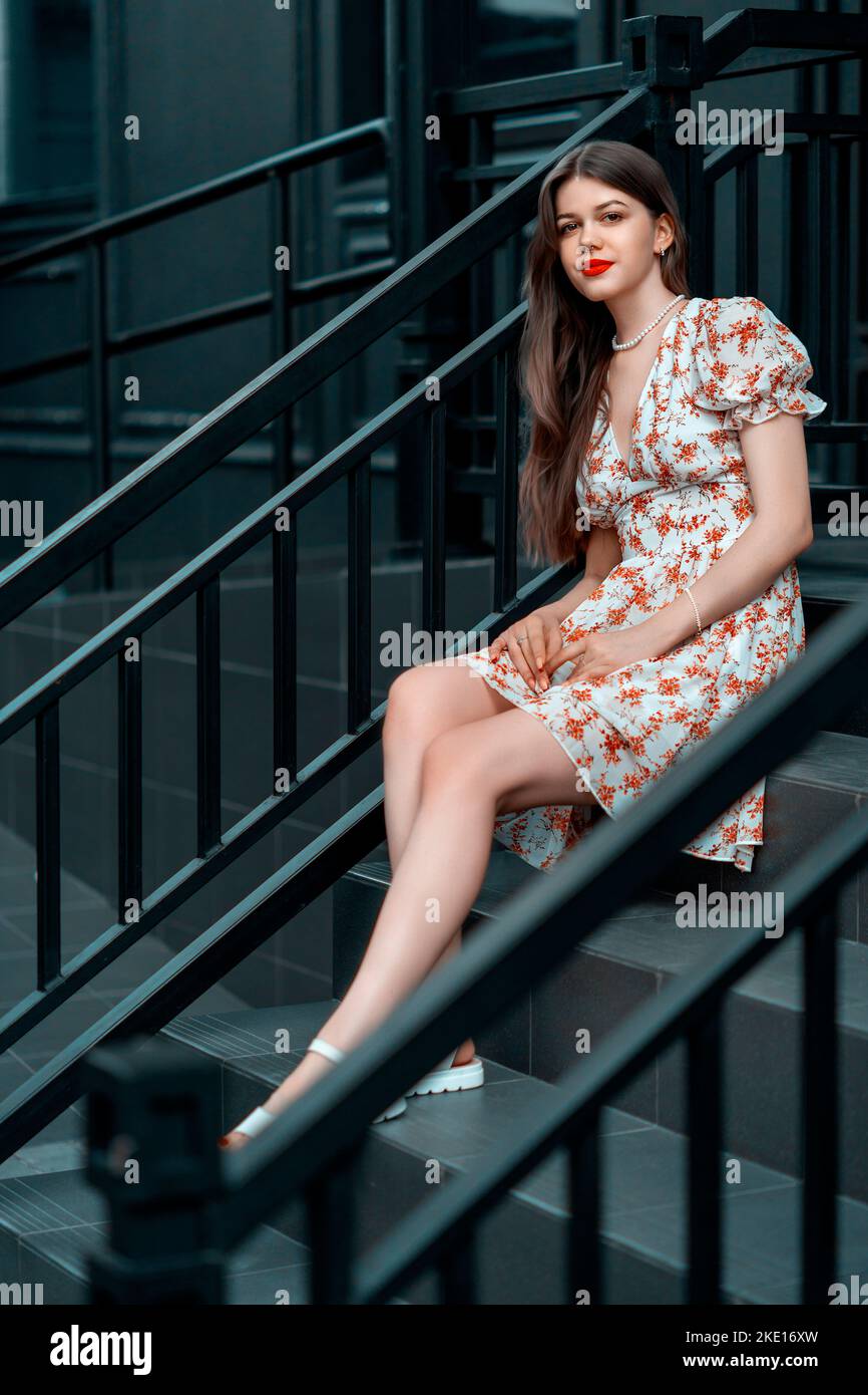 Beautiful girl on stairs hi-res stock photography and images - Alamy