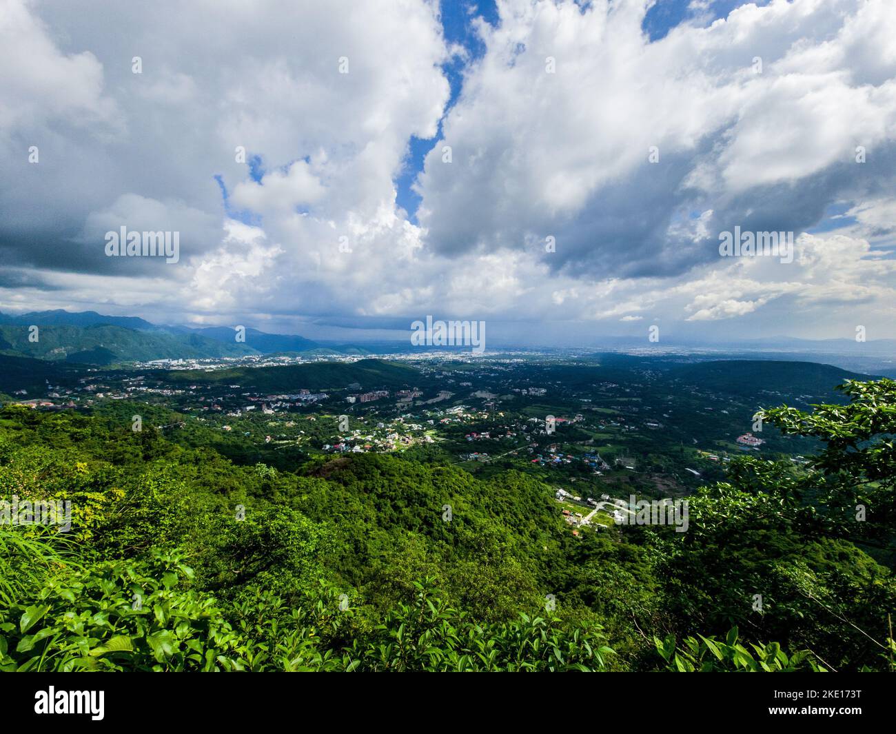 An aerial view of a beautiful forest near the mountains in Dehradun ...