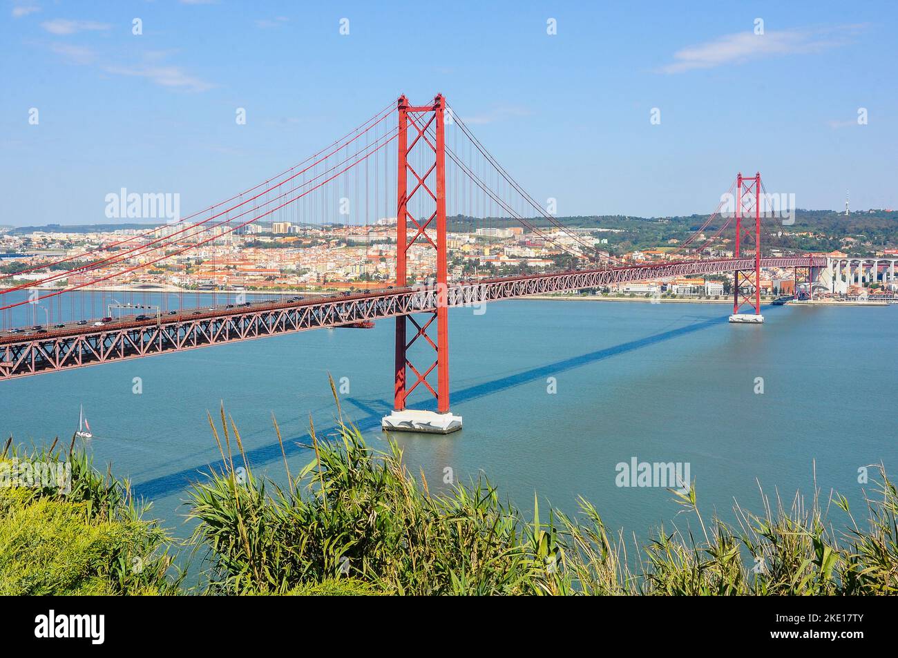 View of the 25 de Abril Bridge crossing the Tagus River in Lisbon ...