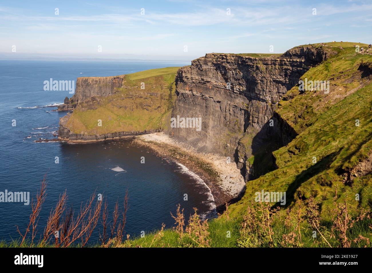 A high rocky cliff near the ocean with a blue sky background Stock ...