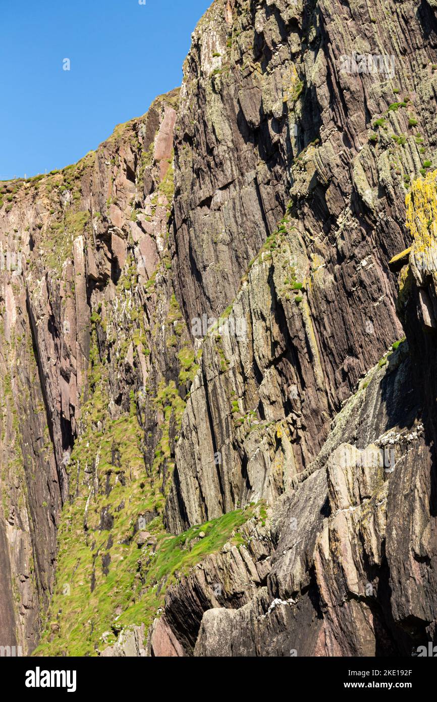 A high rocky cliff near the ocean with a blue sky background Stock ...