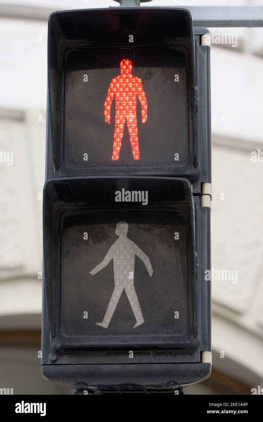 Close up of red figure pedestrian traffic light concept for stop ...