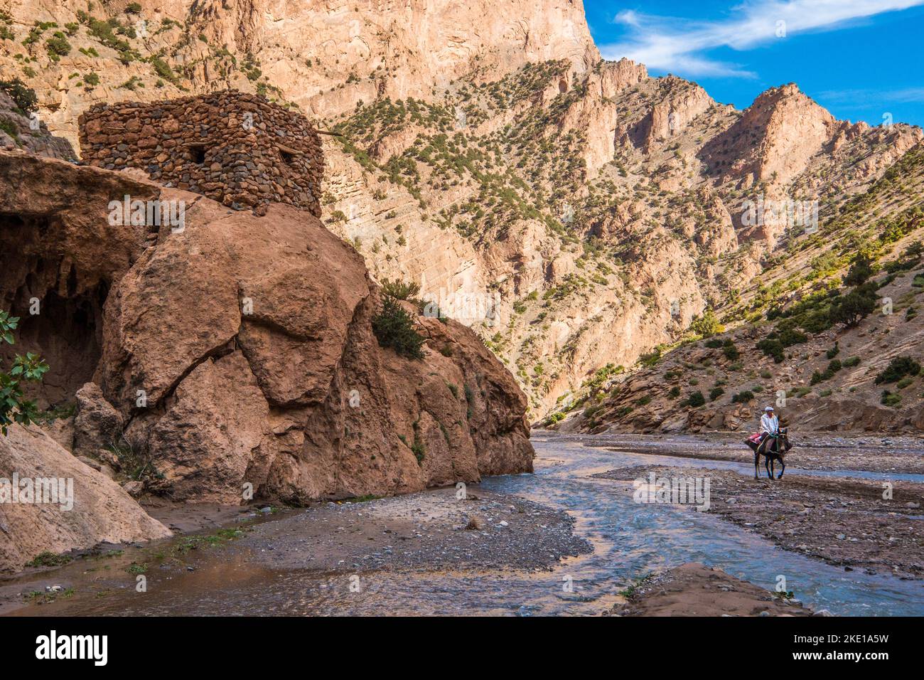 A Berber on horseback in the M'Goun river gorge, Atlas mountains ...