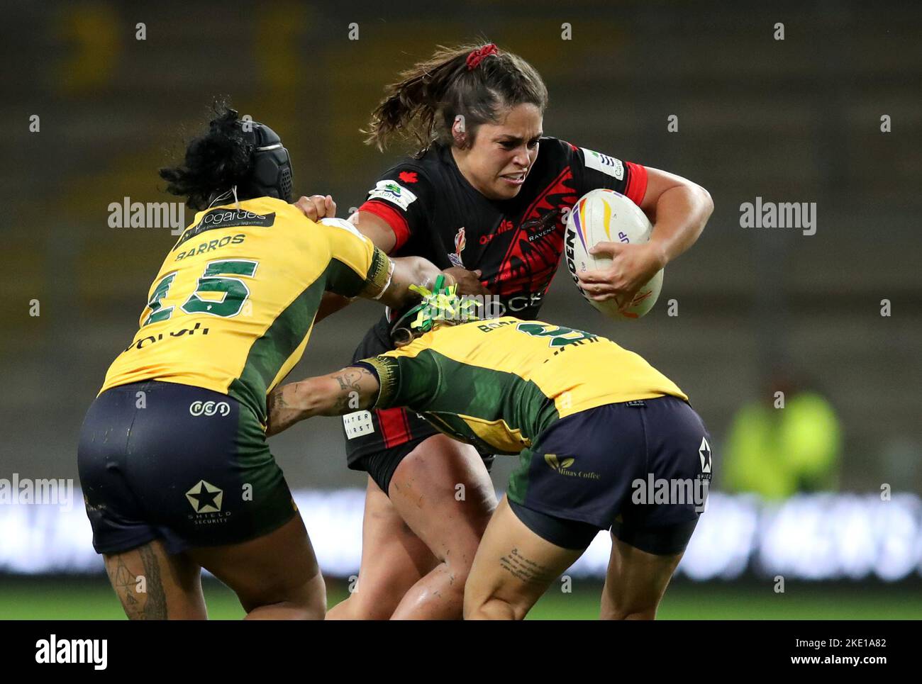 Canada's Sarah Maguire is tackled by Brazil's Franciele Barros (left ...