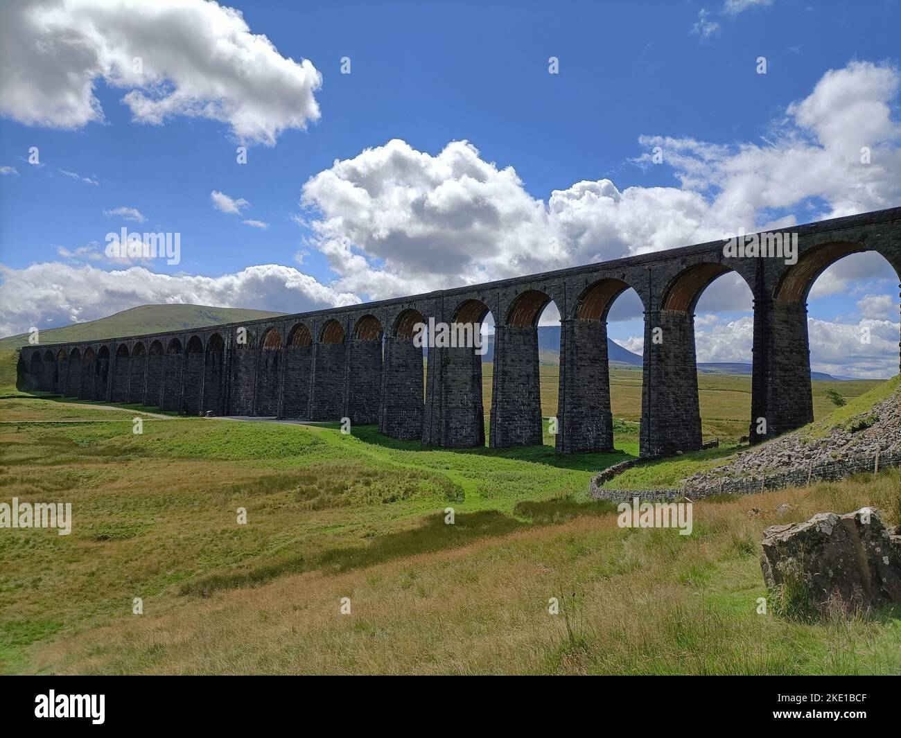 A scenic view of the Ribblehead Viaduct going through built above an ...