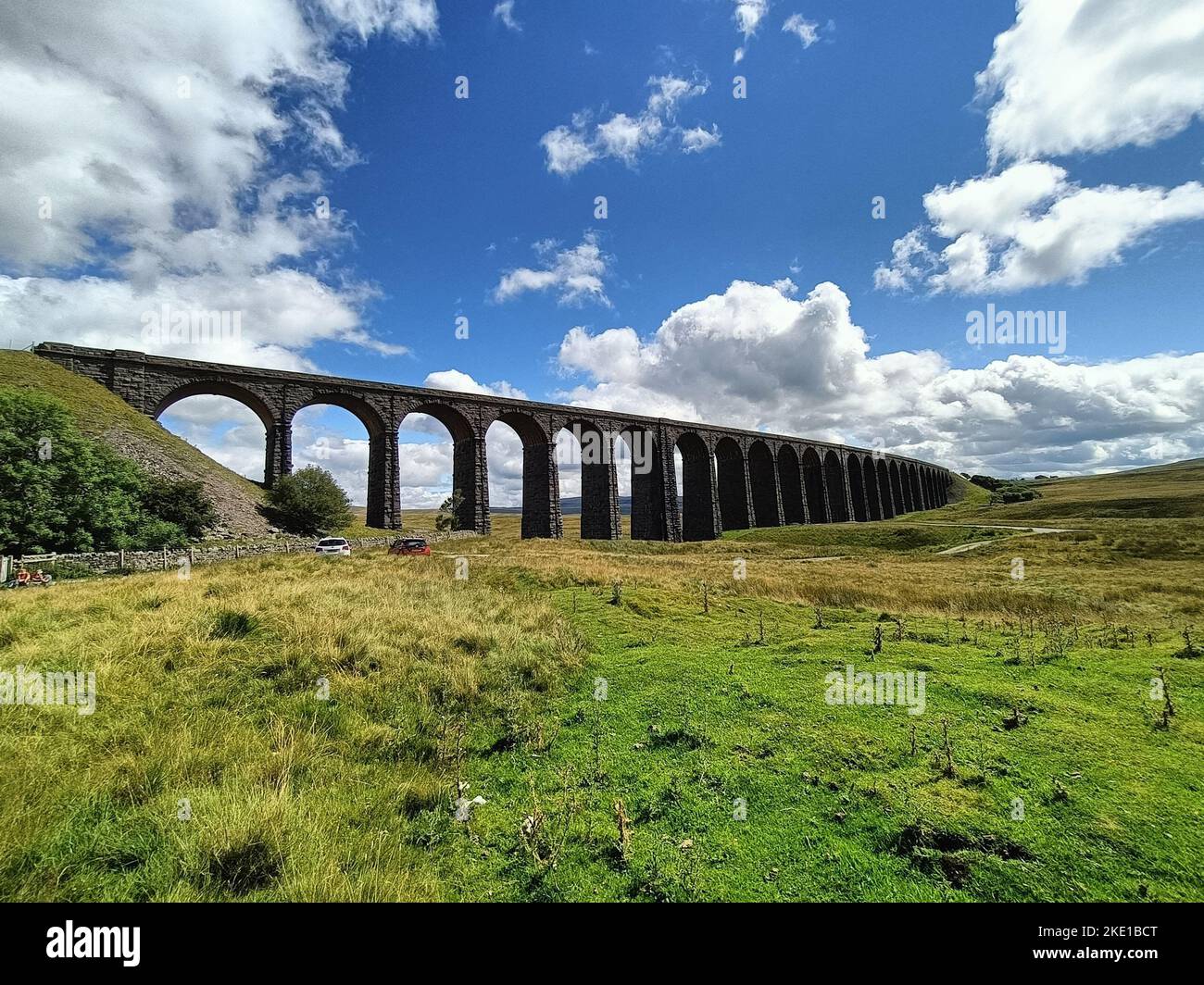 A scenic view of the Ribblehead Viaduct going through built above an ...