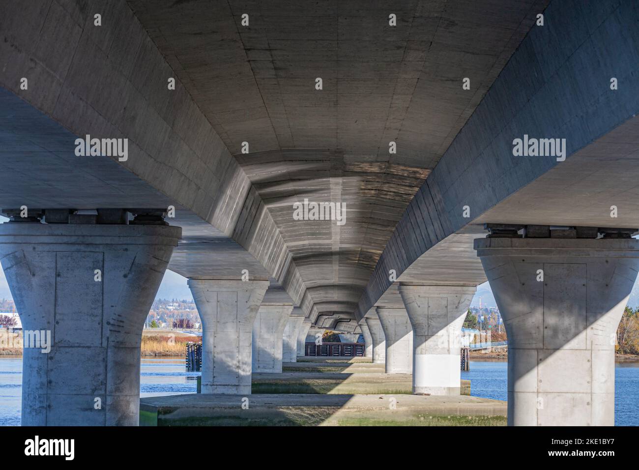Massive concrete bridge supports over an arm of the Fraser River in ...