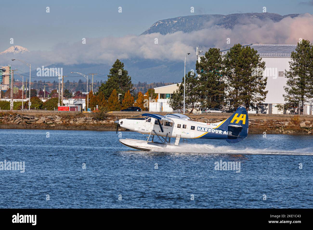 Turbo Beaver float plane taking-off from an arm of the Fraser River in ...