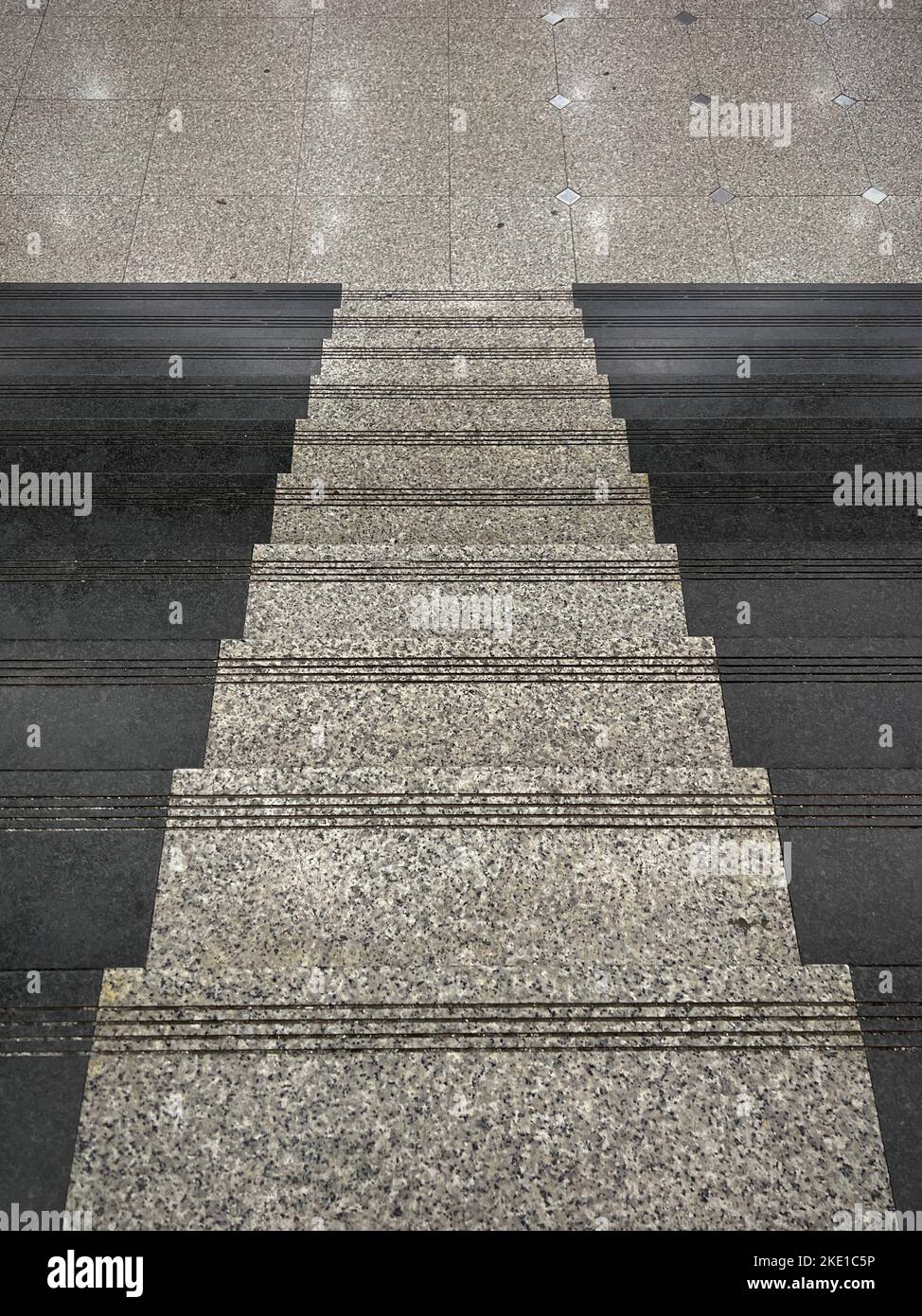 Monochromatic stairs In symmetry going down Stock Photo - Alamy