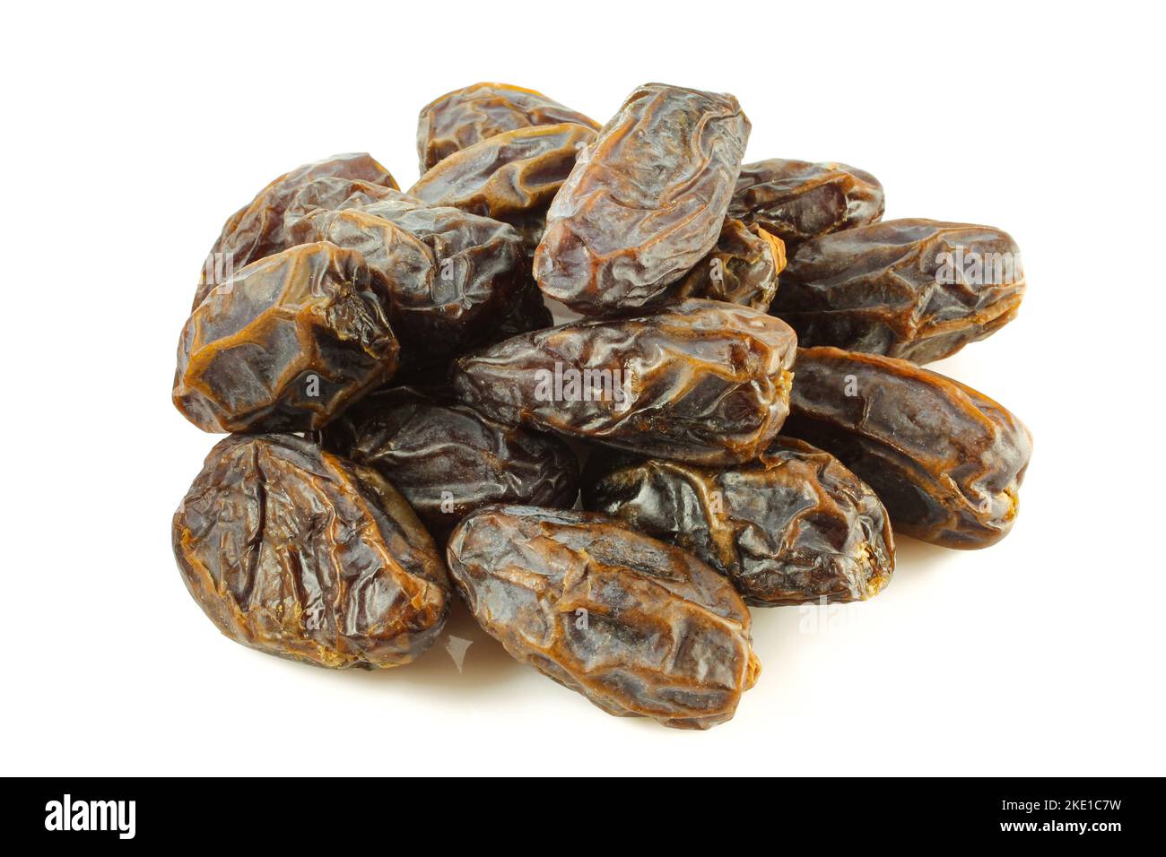 Pile of medjool dates isolated on white background Stock Photo - Alamy