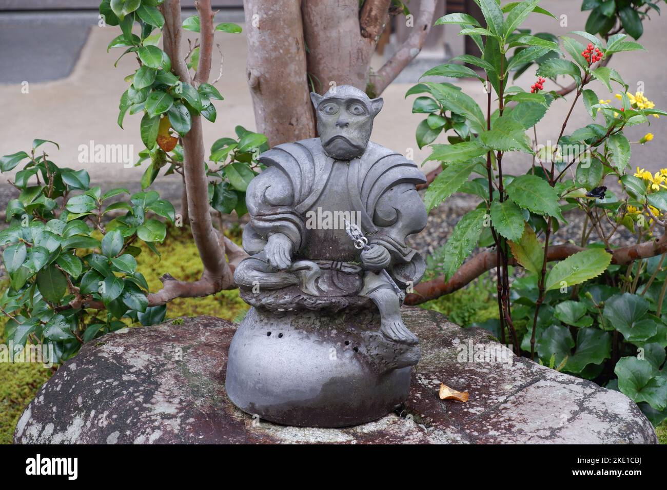 A monk monkey statue in the garden of Saikyo-ji Buddhist temple in ...