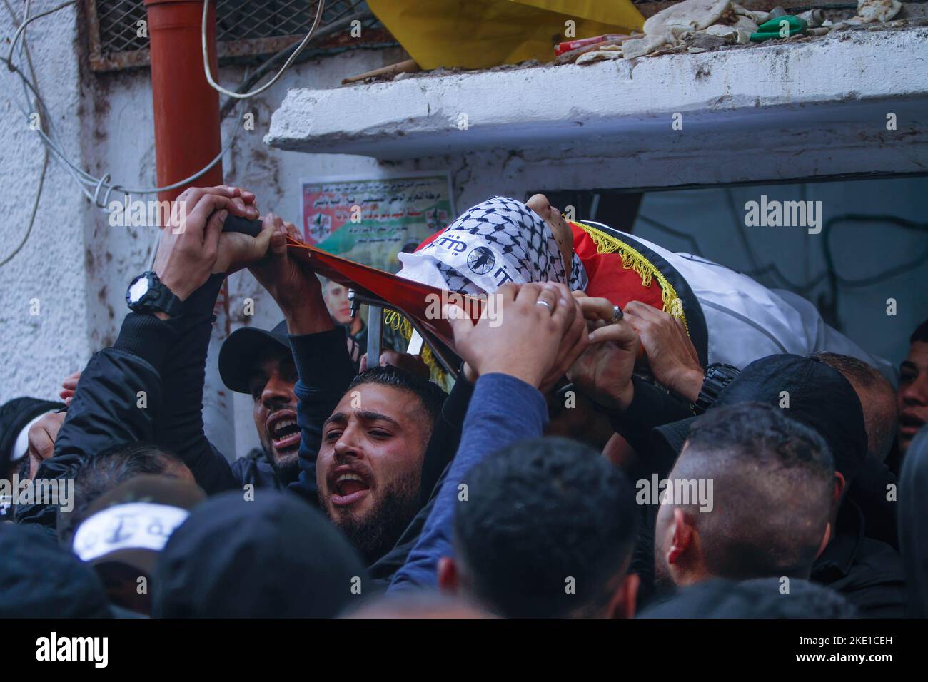 (Editors note image depicts death) Mourners carry the body of ...
