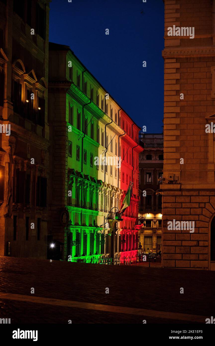 A building illuminated with the colors of the Italian flag (green ...