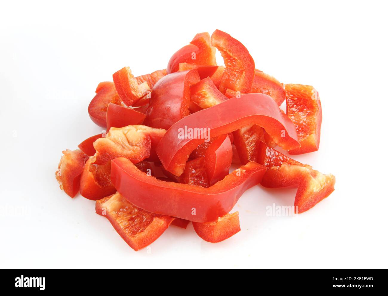 Pile of sliced red paprika pieces isolated on white background Stock ...