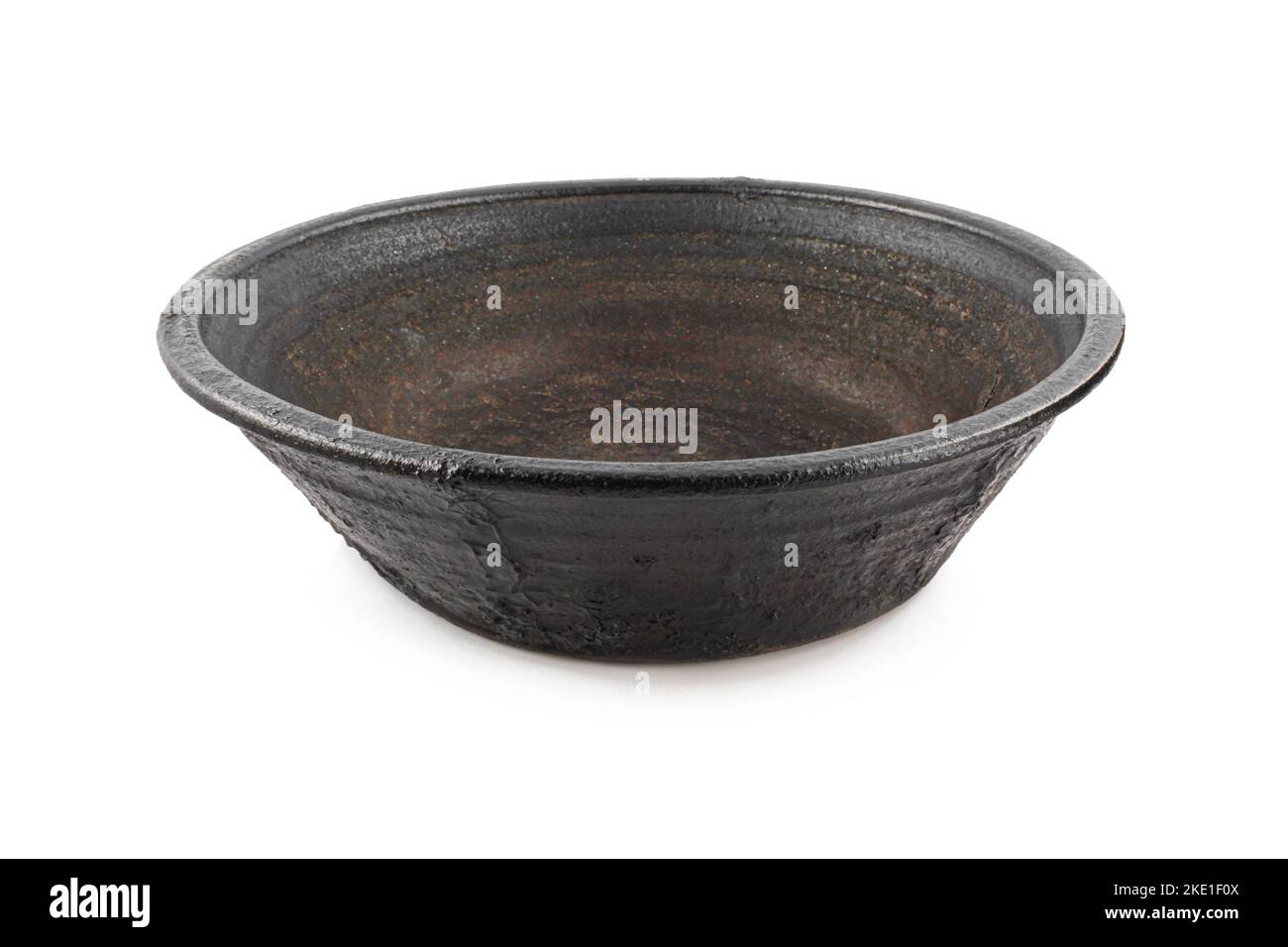 Black empty earthen vessel isolated on white background. Traditional ...