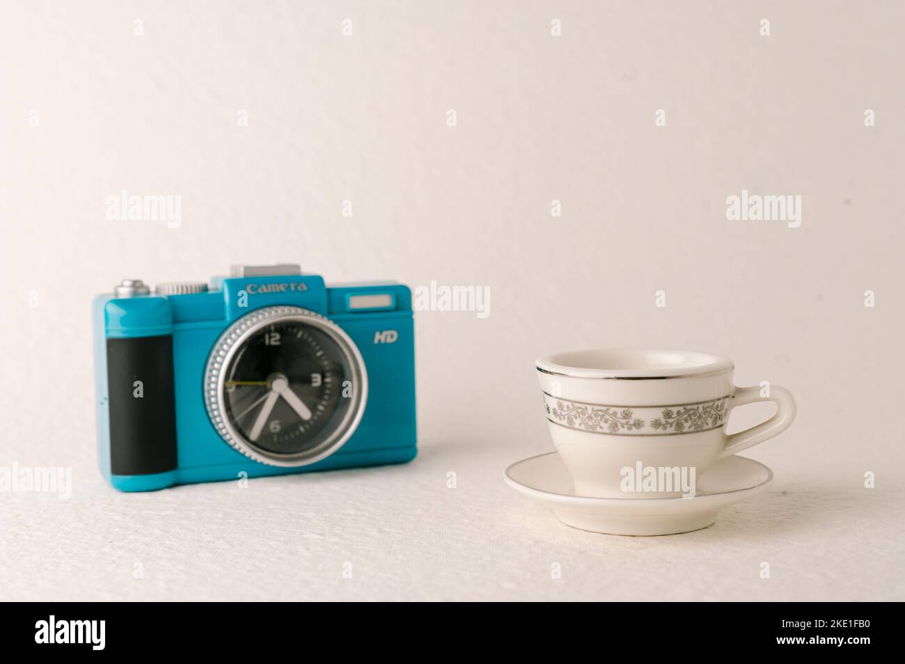 cup of coffee with clock on white background Stock Photo - Alamy
