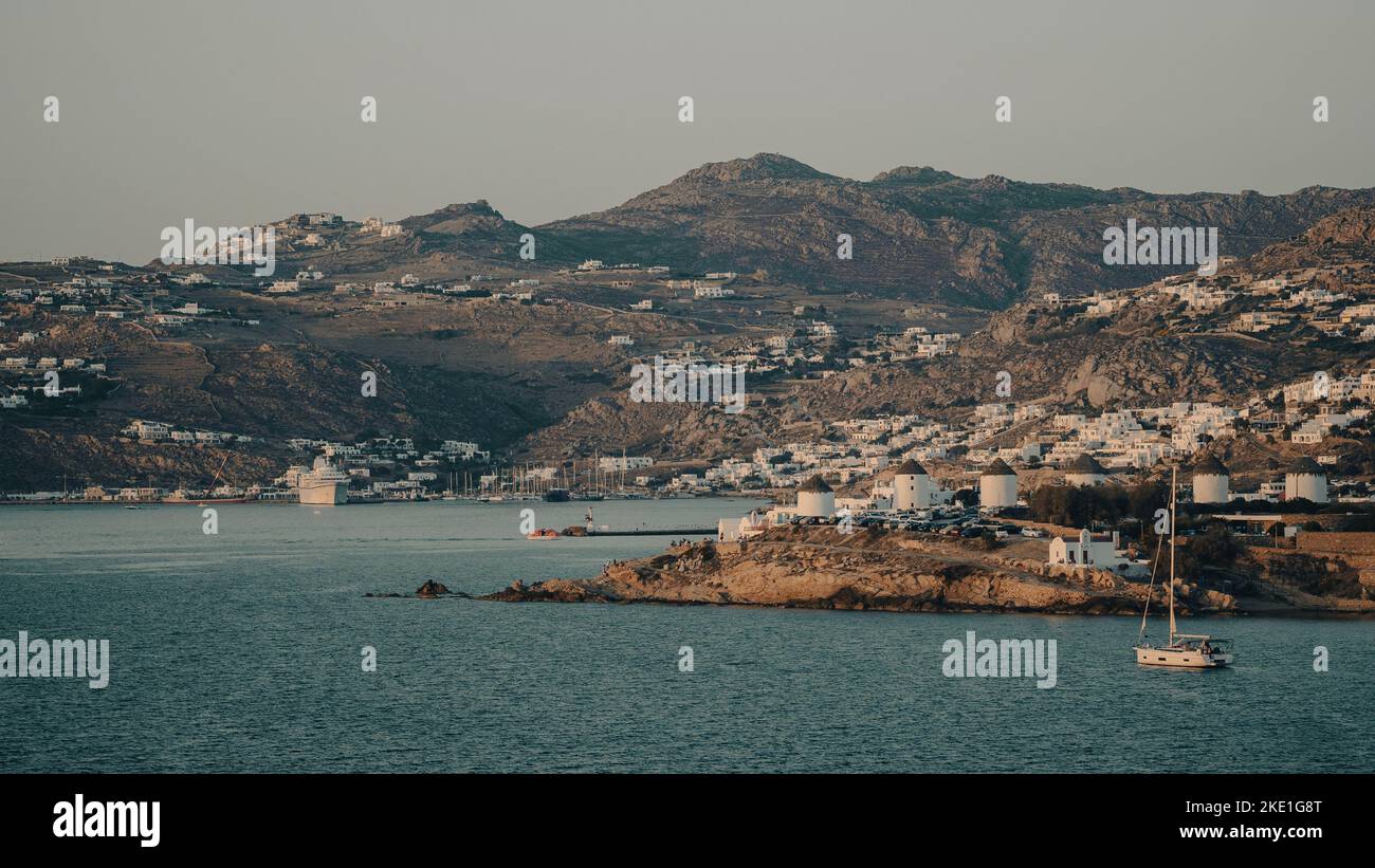 The famous resort island of Mykonos with the view of white buildings ...