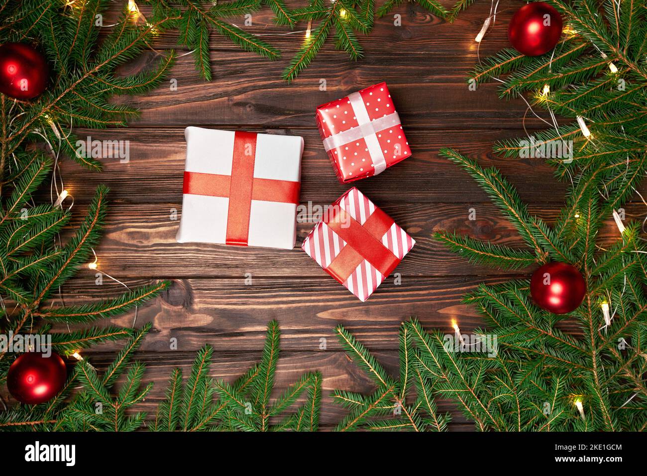 three Christmas gifts on a Christmas background Stock Photo - Alamy