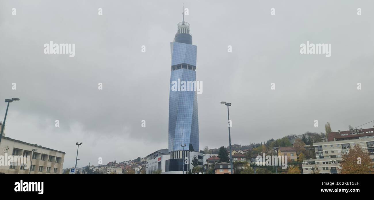 A low-angle of Avaz Twist tower in Sarajevo against gloomy, cloudy sky ...