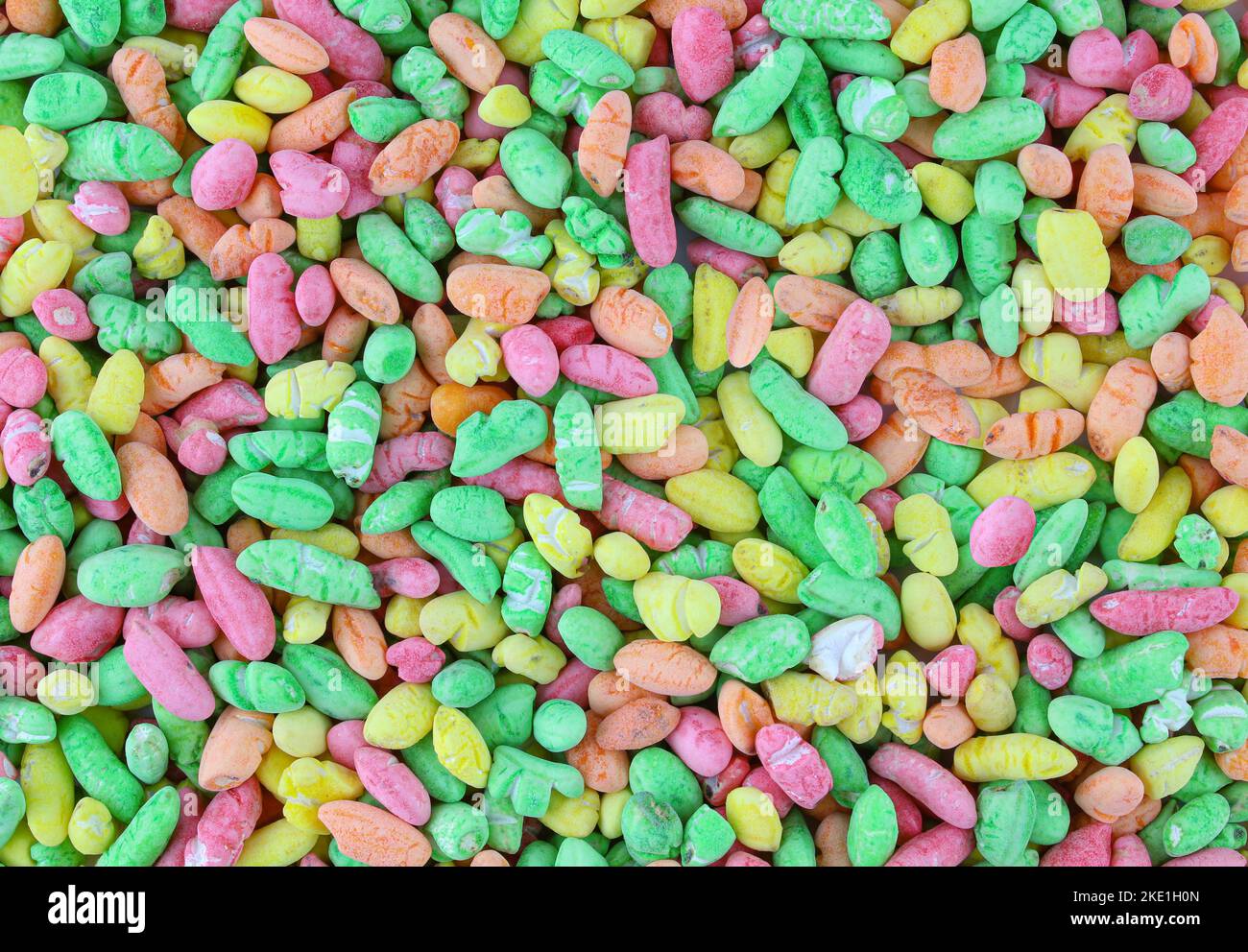 Colorful puffed rice sweets. Background of rainbow drops cand isolated ...