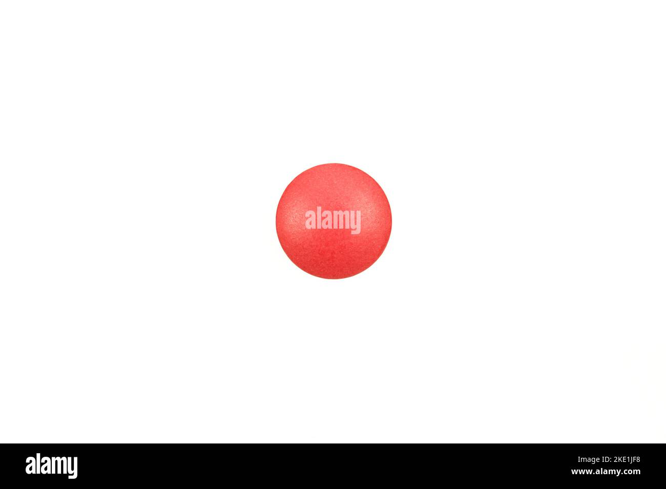 Red tablet pill medication isolated on white background.One single ...