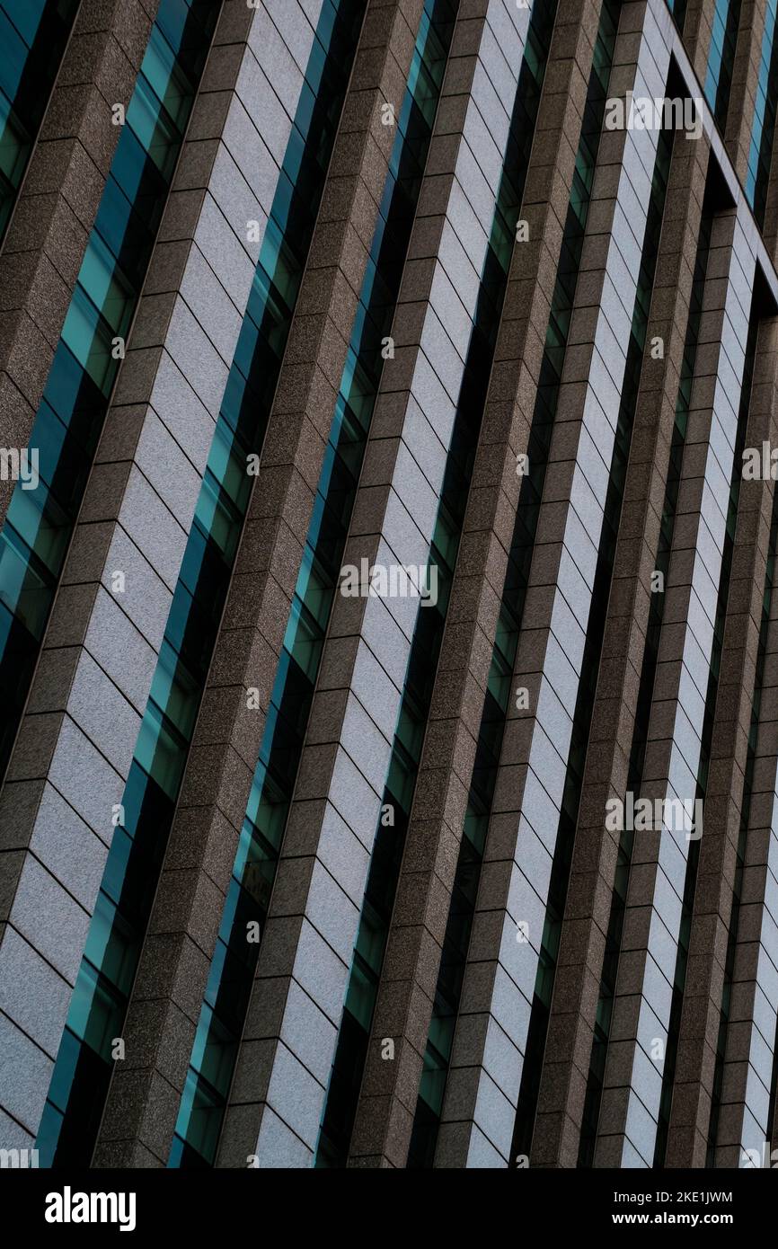 A high business architecture building with white pattern columns and ... A high business architecture building with white pattern columns and ...