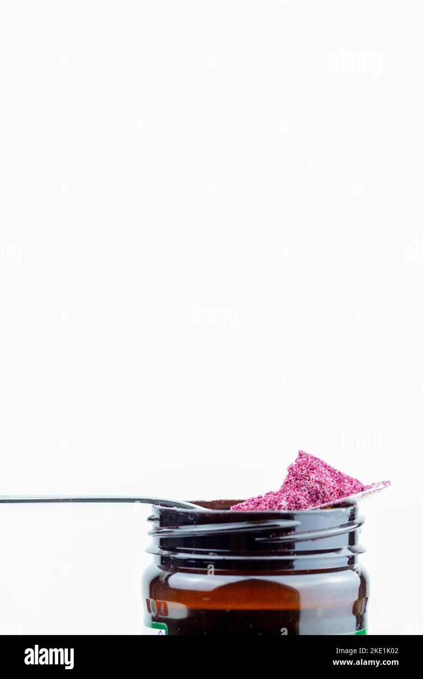 A jar of beetroot powder isolated on white Stock Photo - Alamy