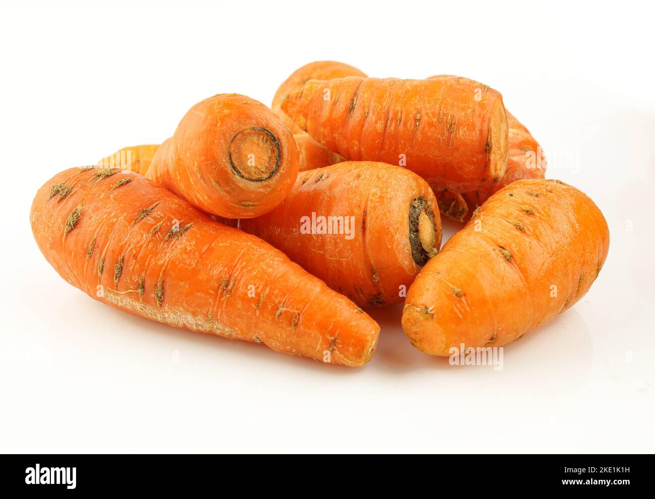Pile of small organic homegrown carrots isolated on white background ...