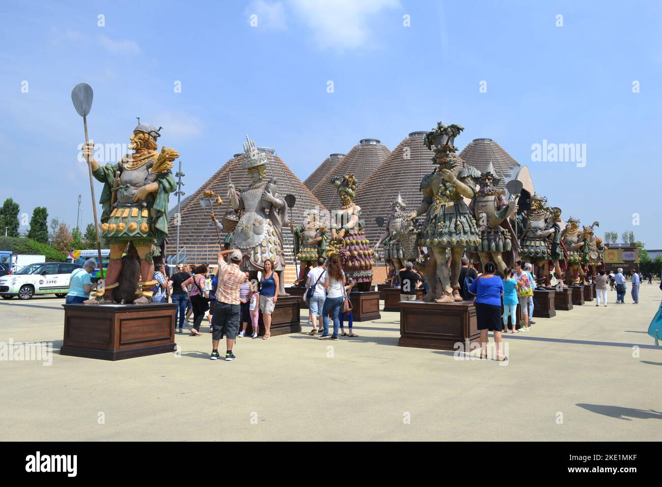 Statues of the Food People characters on pedestals standing in a group ...