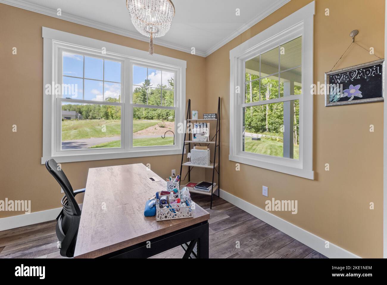The interior design of a beautiful office room with a desk and a window ...