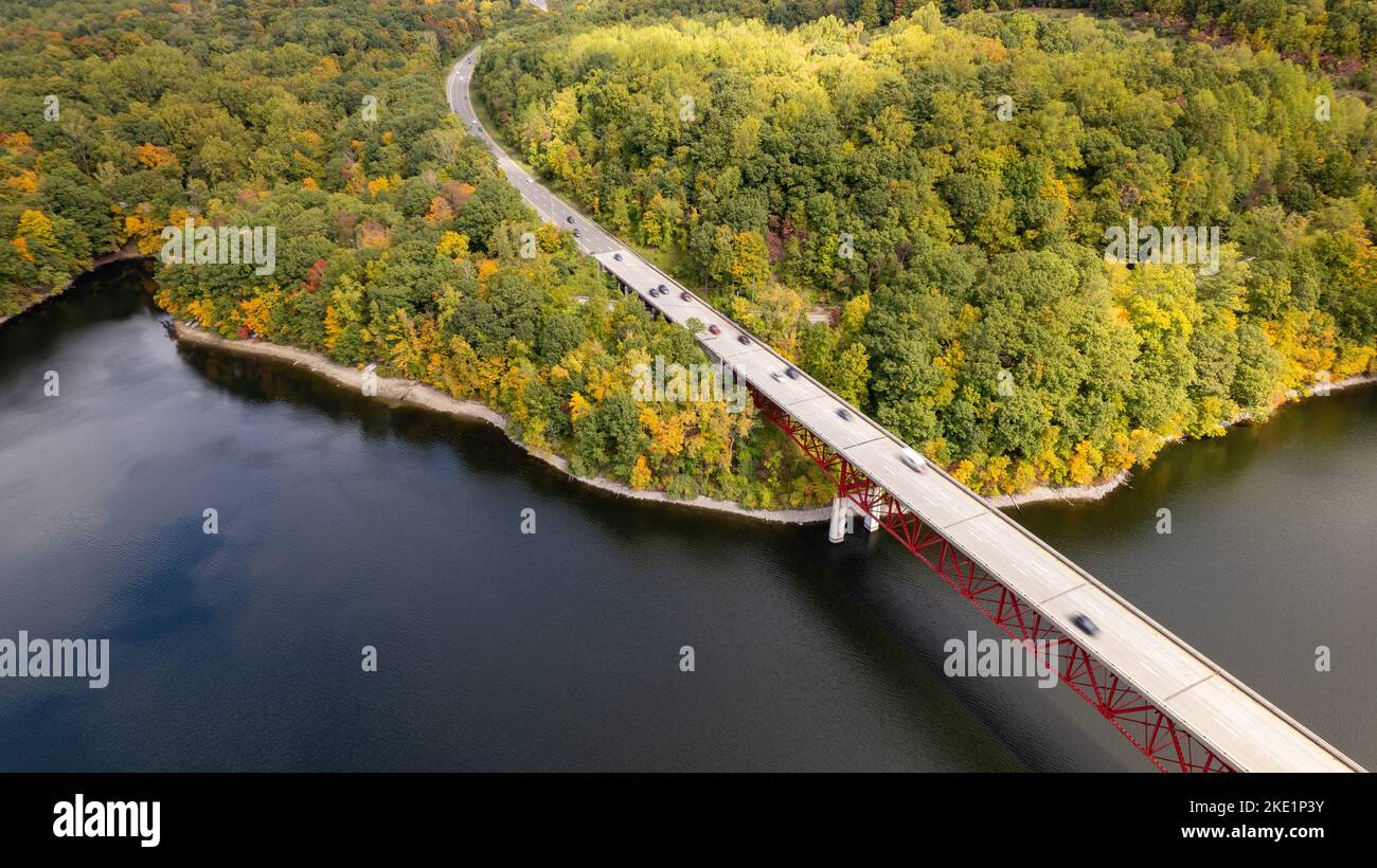 A drone shot of a bridge over the New Croton Reservoir on a sunny day ...