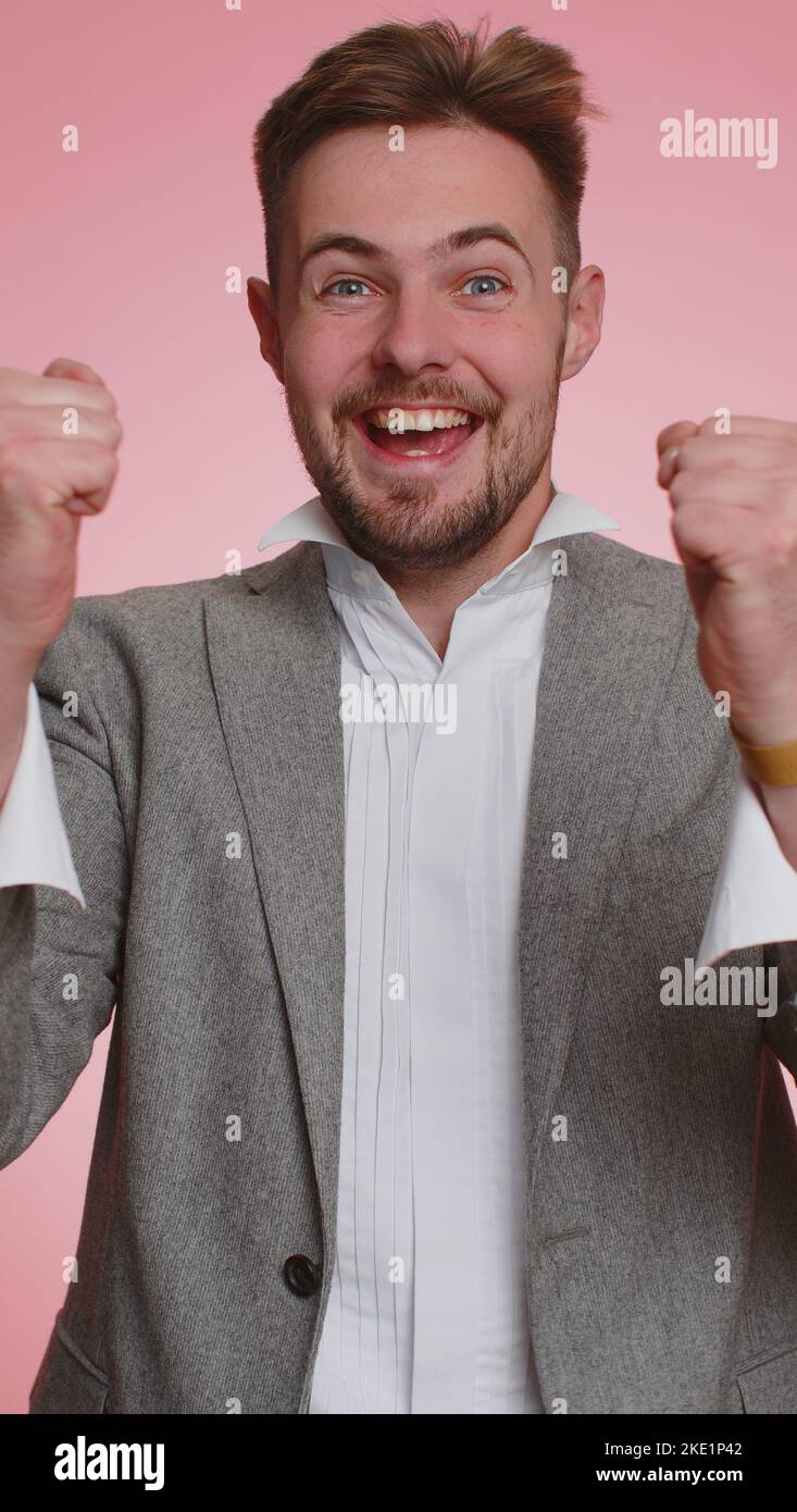Happy joyful business office man shouting, raising fists in gesture I ...