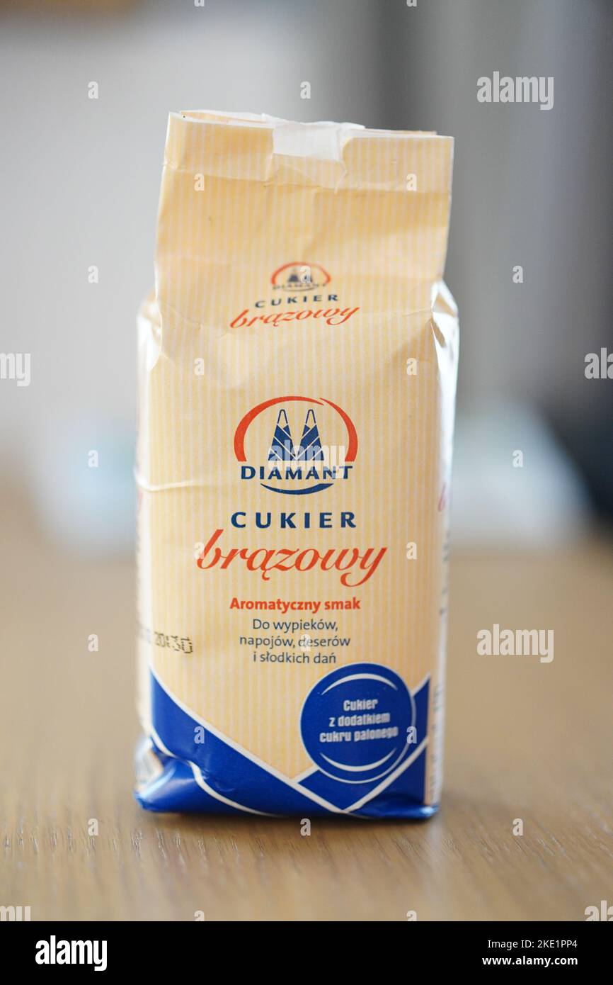 A Polish Diamant brand brown fine sugar in an opened paper bag on a ...