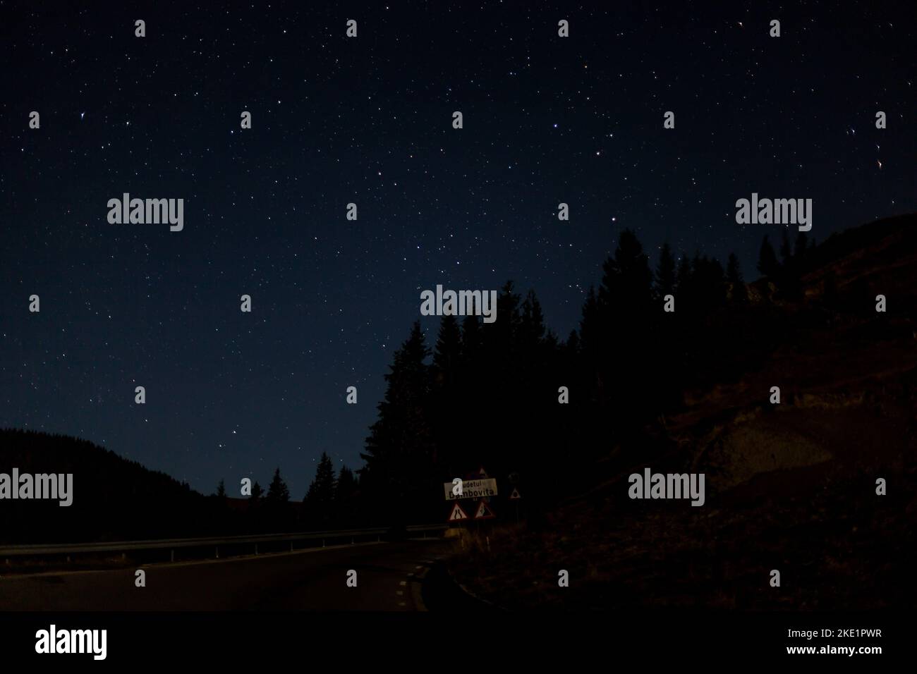 A low angle shot of a dark blue starry night sky over a forest Stock ...