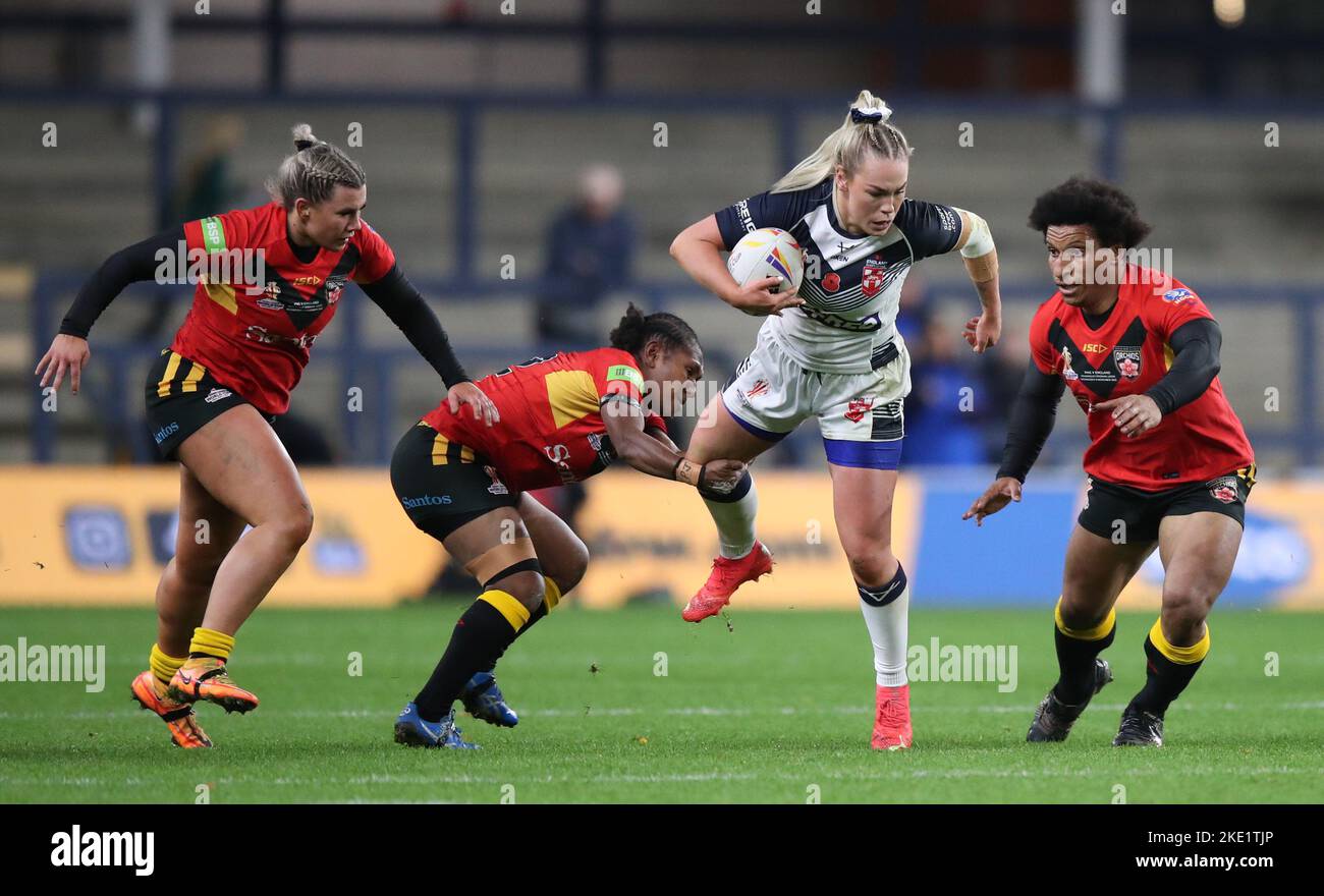 England's Hollie Dodd carries the ball during the Women's Rugby League ...