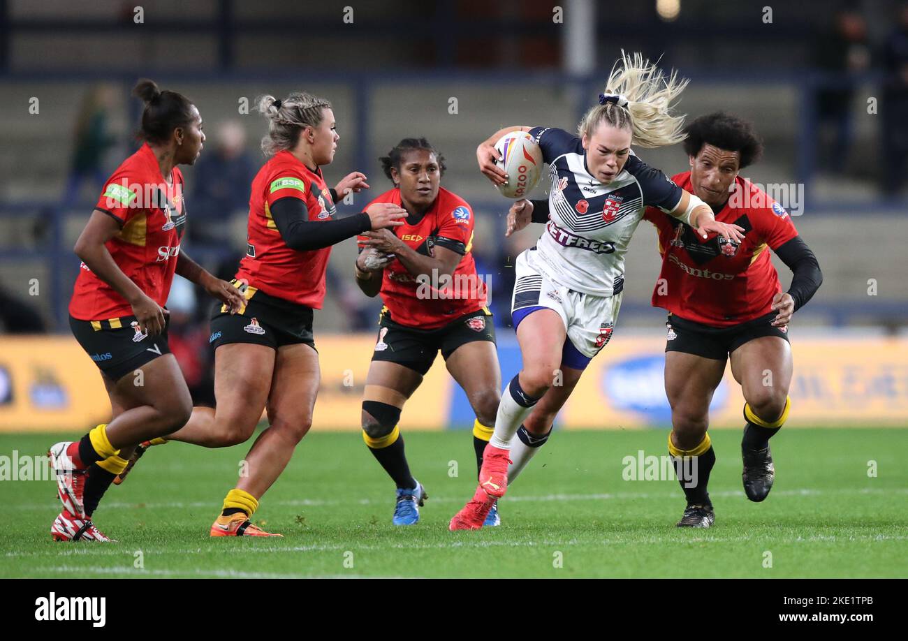 England's Hollie Dodd carries the ball during the Women's Rugby League ...