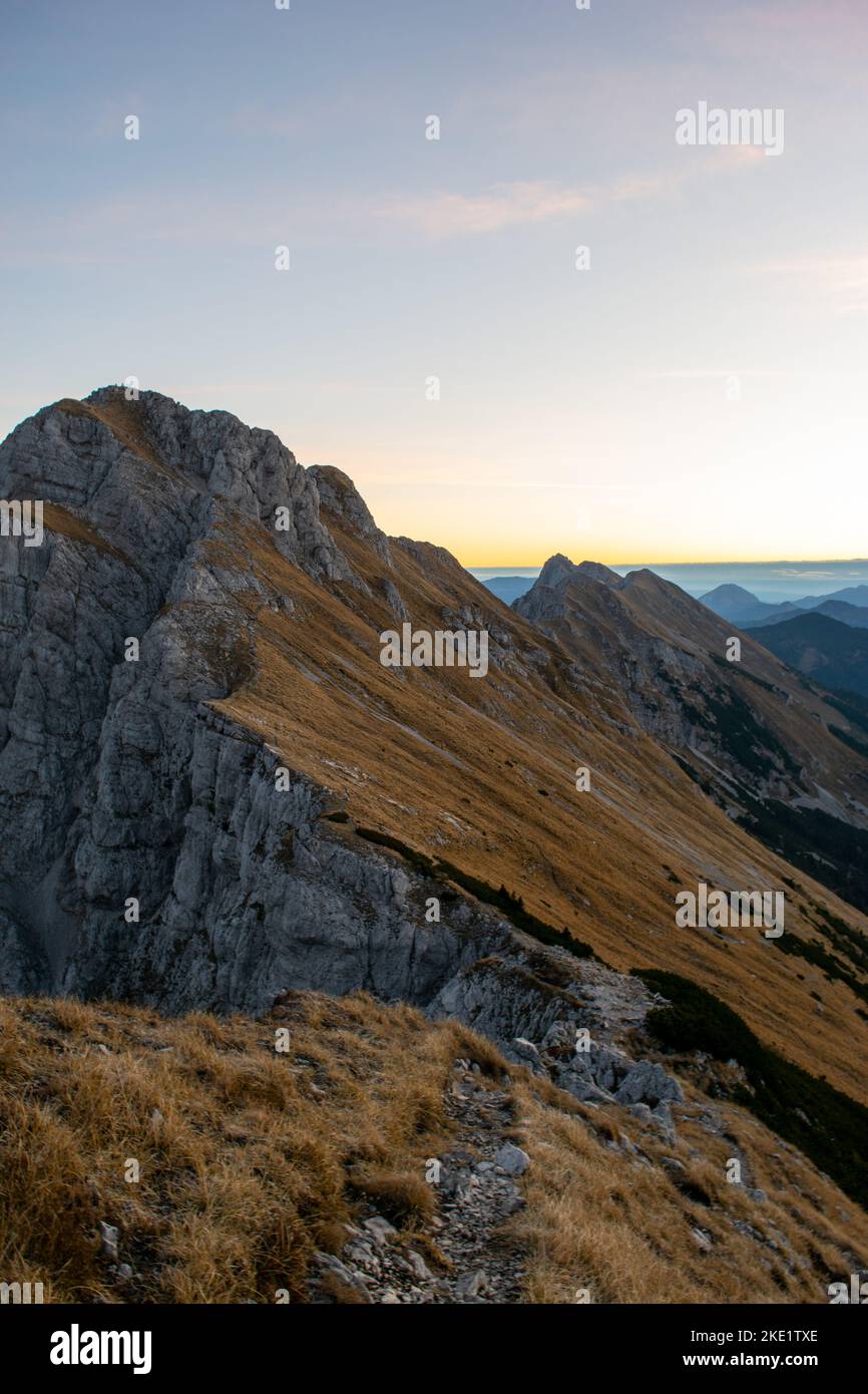 Sunrise in mountains in autumn with golden grass leaves you speechless ...