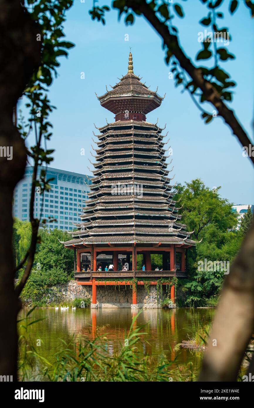 A vertical shot of the ancient tower in Chinese Ethnic Culture Park ...