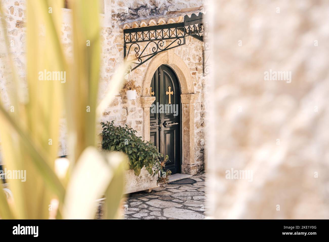 A church building entrance with black door Stock Photo - Alamy