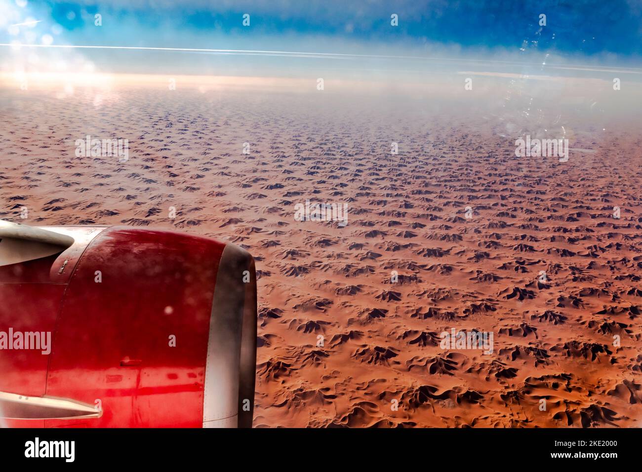 Aerial airplane view of Sahara Desert infinite extend red colored sand ...