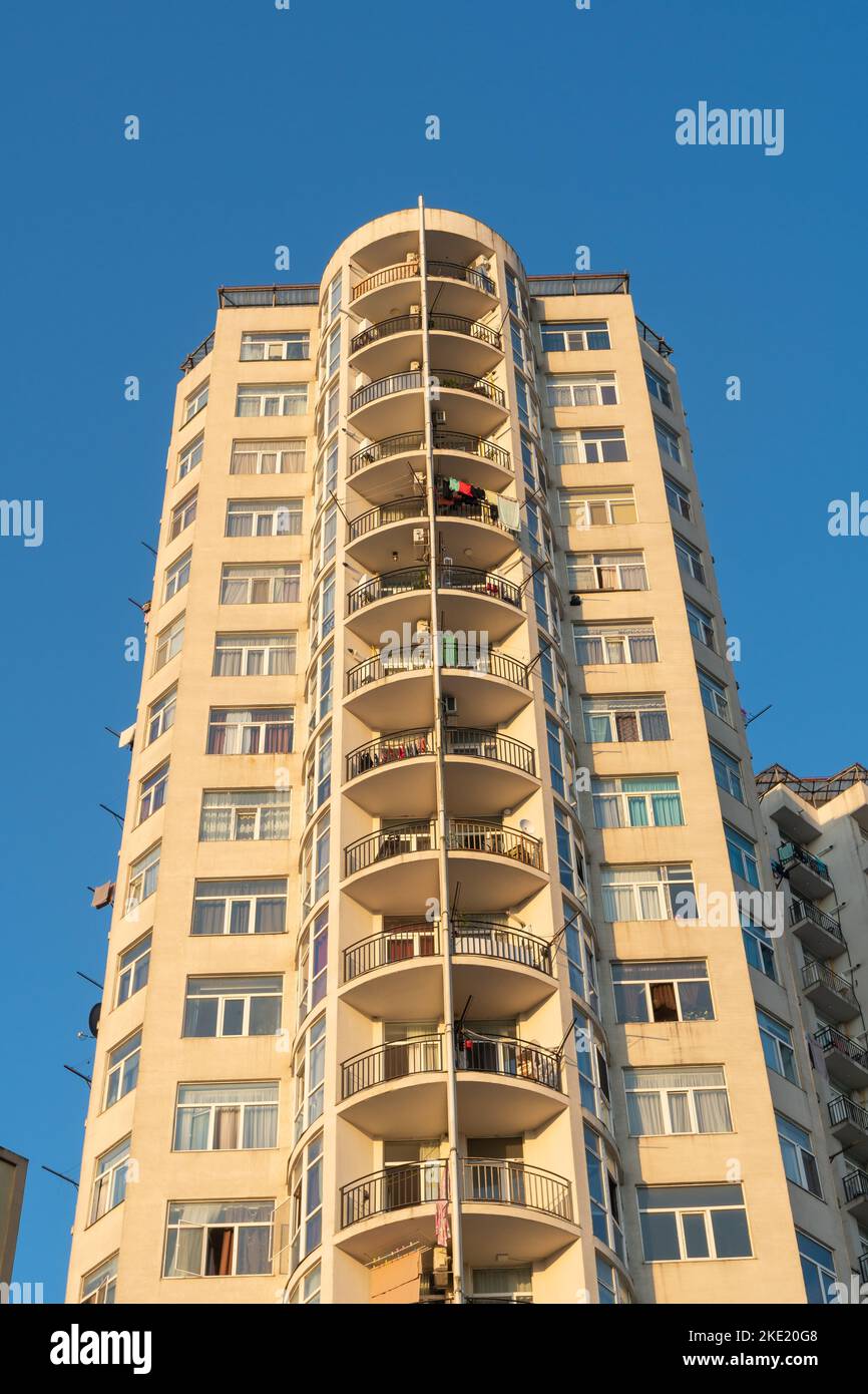 multi-storey residential building against blue sky in Batumi ...