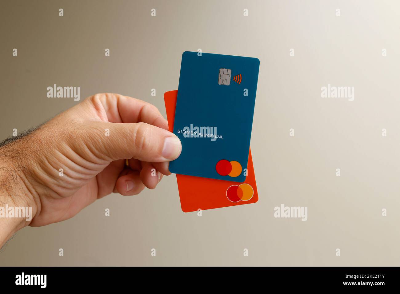 Minas Gerais, Brazil - July 09, 2022: green and orange credit cards ...