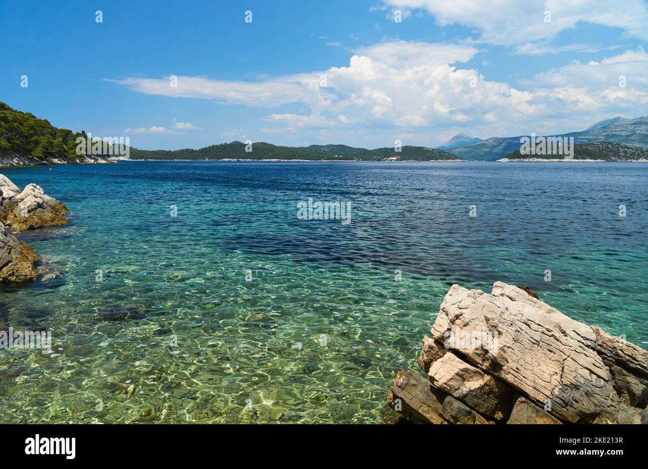 A scenic view of a blue seascape with clean water in sunny weather on ...